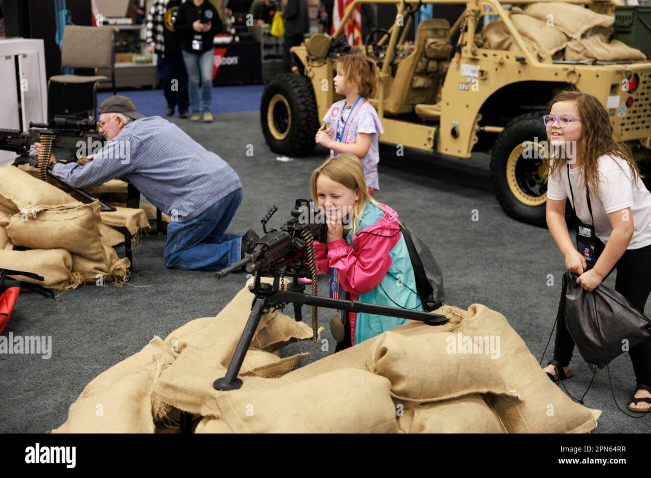 INDIANAPOLIS, INDIANA - APRIL 16: A girl looks through the sights of a ...
