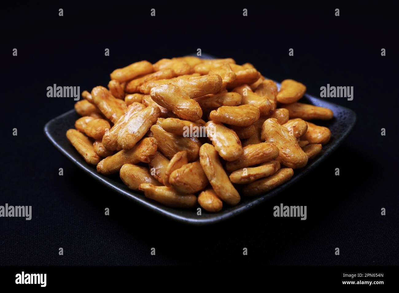 A photo shows Kaki no tane, Japanese snack and small crescent-shaped ...