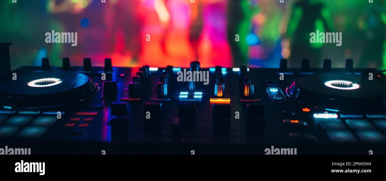 DJ mixer controller panel for playing music and partying in a nightclub ...