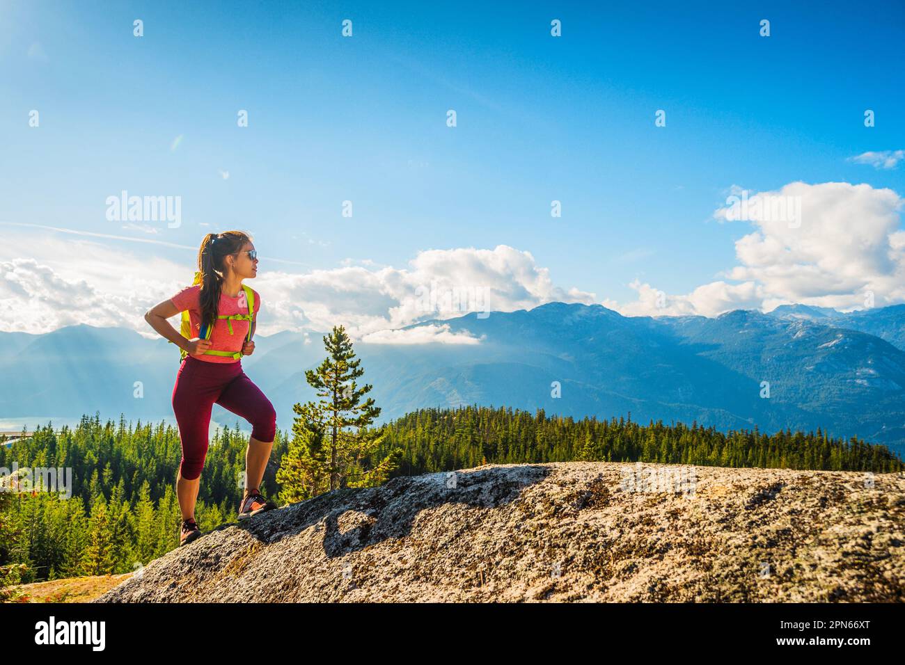 Hiking woman hiker on mountain hike trail enjoying view wearing ...