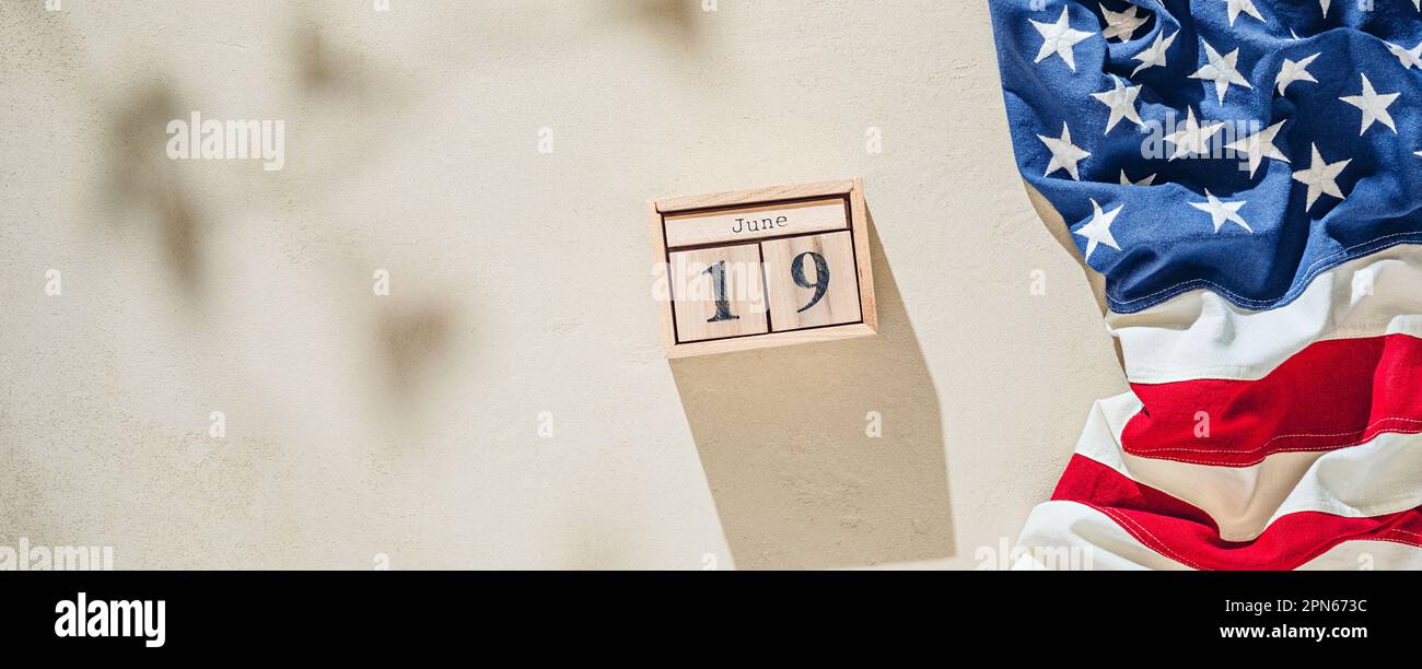 Juneteenth background with American flag and wooden calendar. June 19 ...