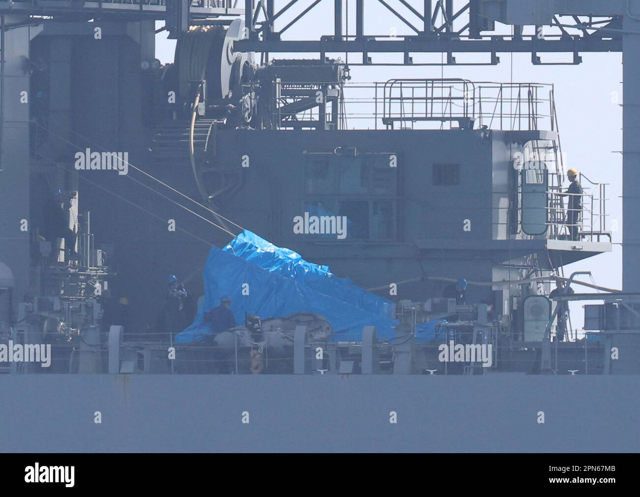 Crew members of the Chihaya, a submarine rescue ship of the Japan ...
