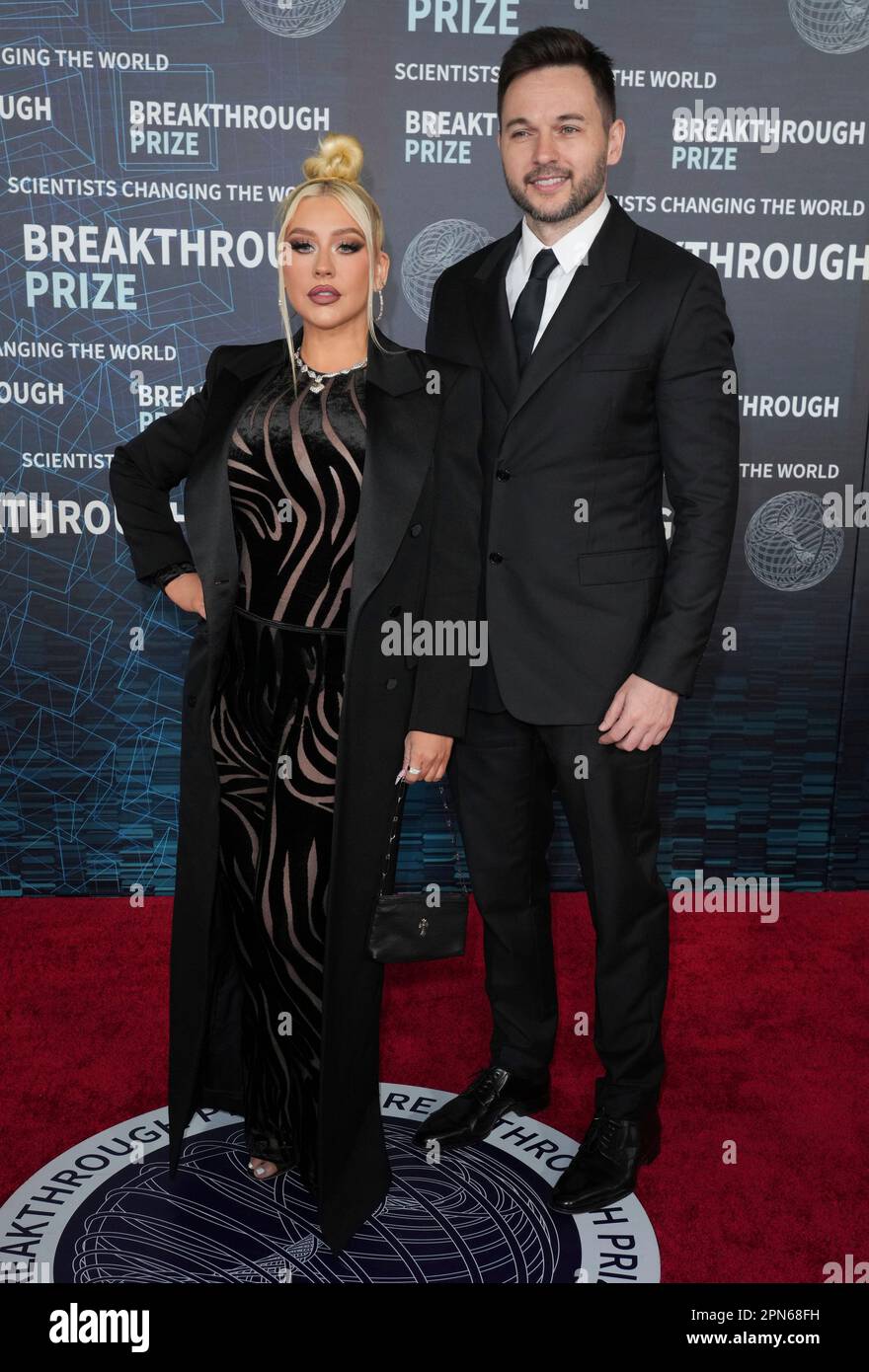Christina Aguilera, left, and Matthew Rutler arrive at the ninth ...