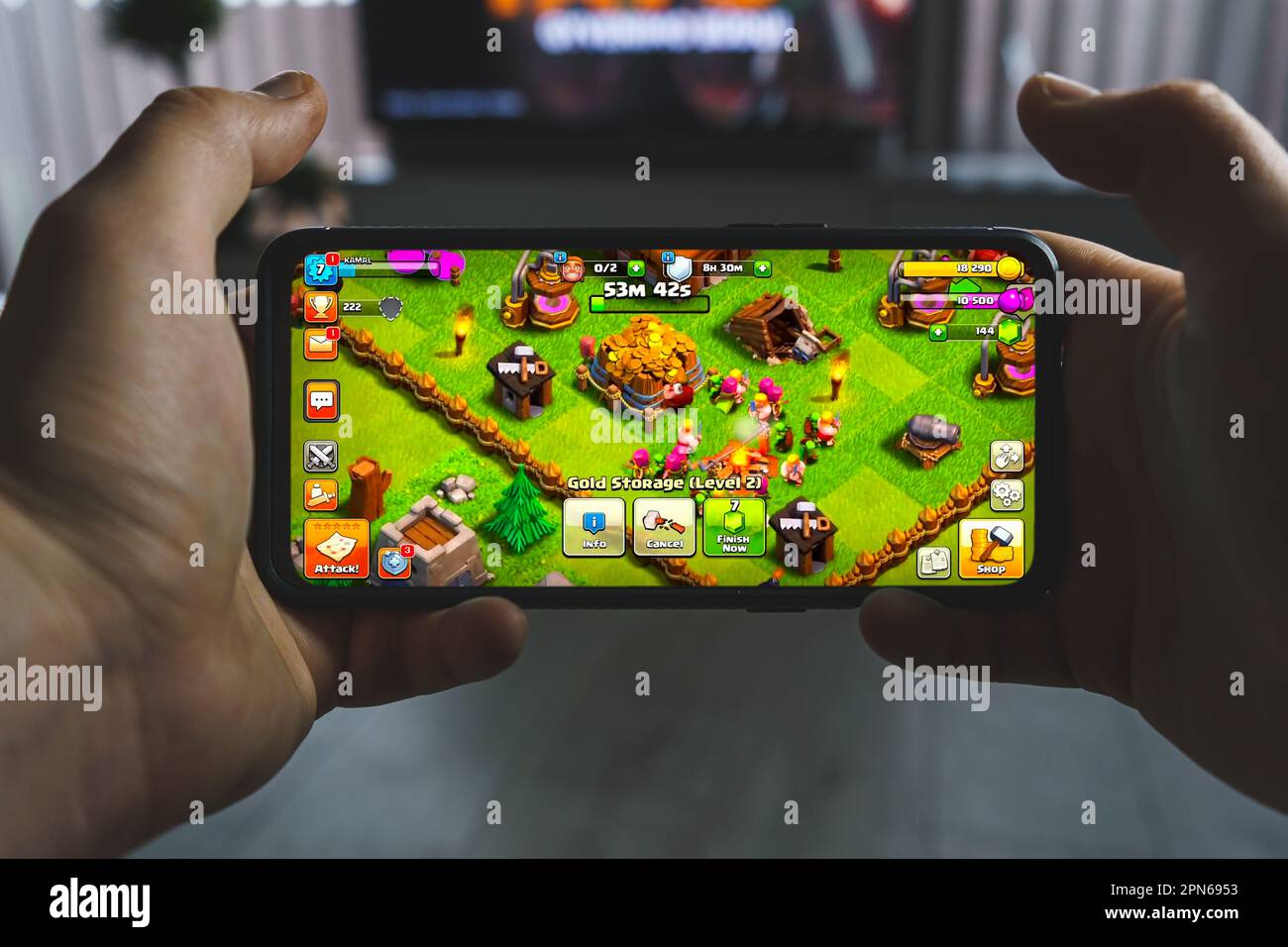 Playing Clash of clans mobile game. Point of view gaming on smartphone ...