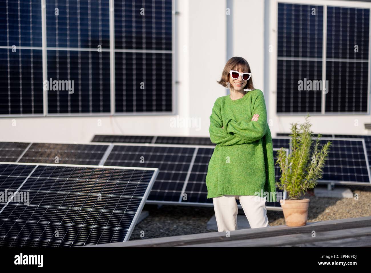 Happy house owner with a solar plant Stock Photo - Alamy