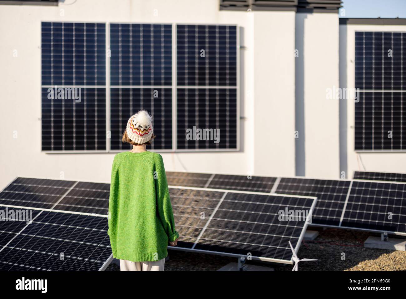 Happy house owner with a solar plant Stock Photo - Alamy