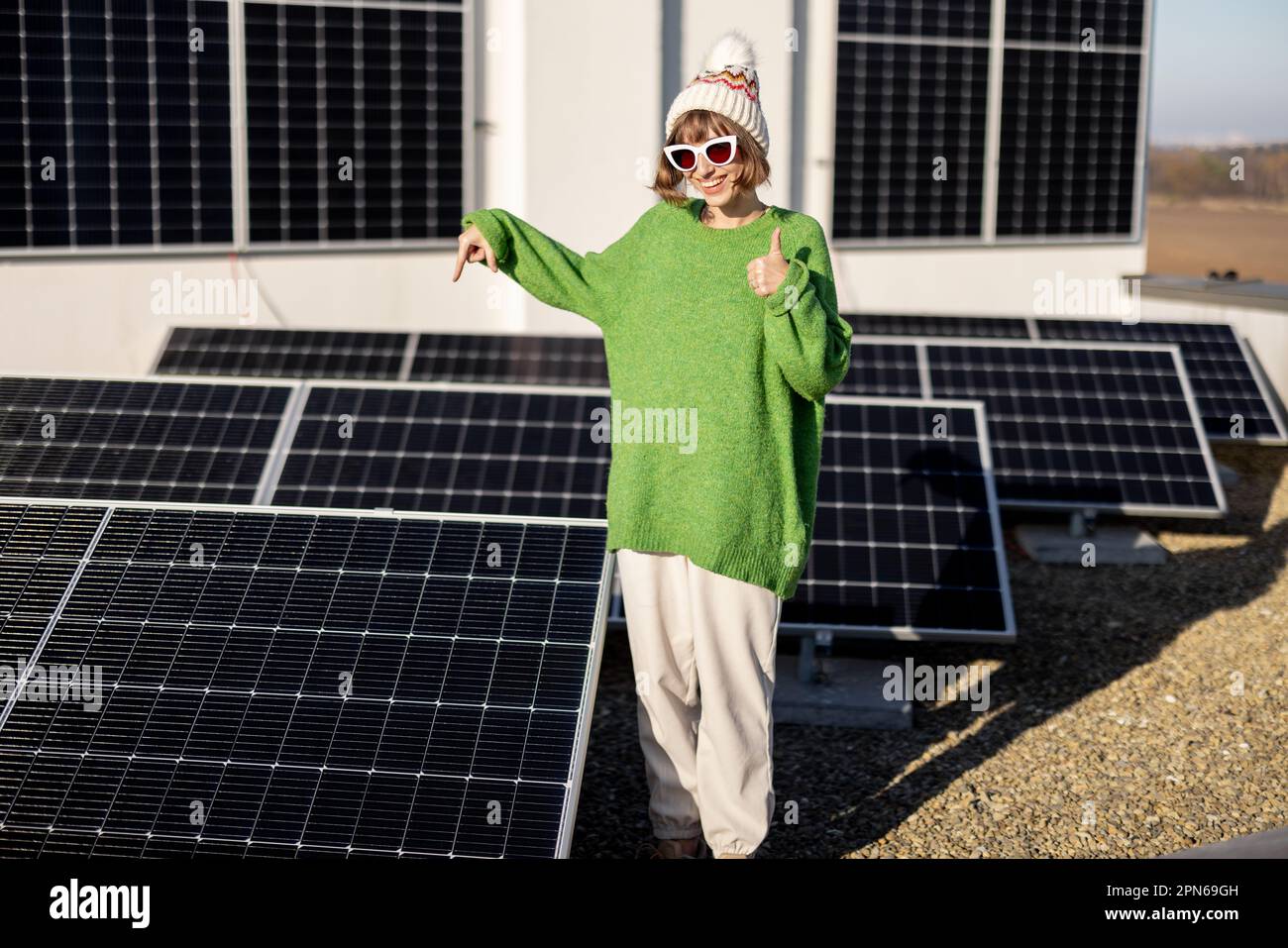 Happy house owner with a solar plant Stock Photo - Alamy