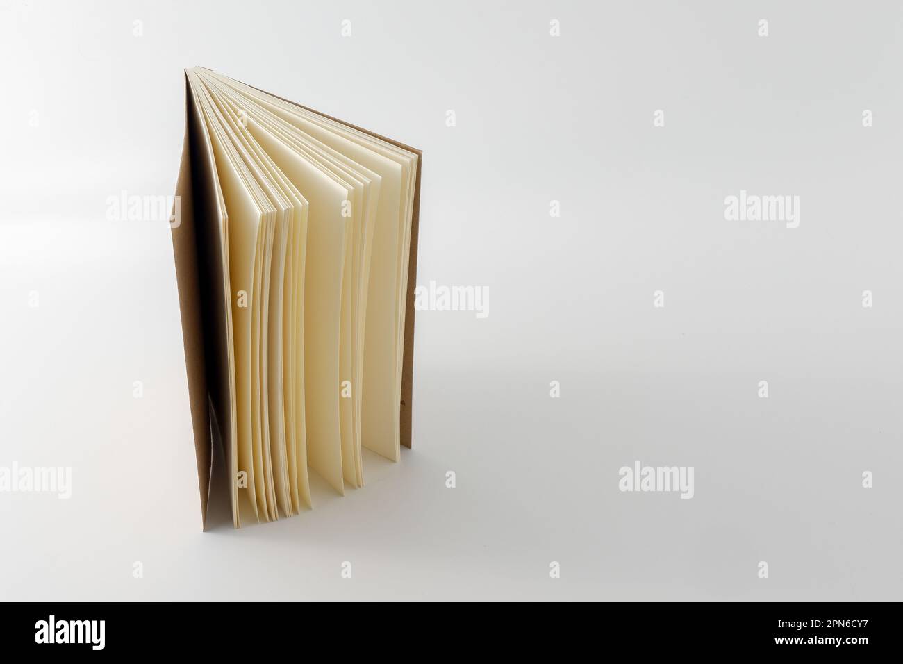 Recycled paper book on white background Stock Photo - Alamy
