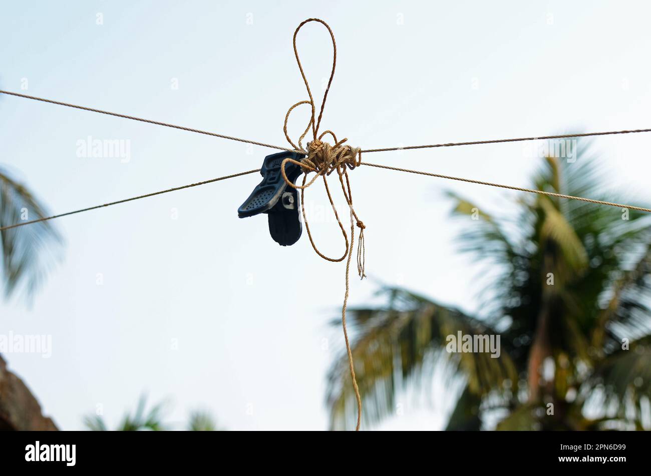 A clip is stuck in the middle of many rope tangles Stock Photo - Alamy