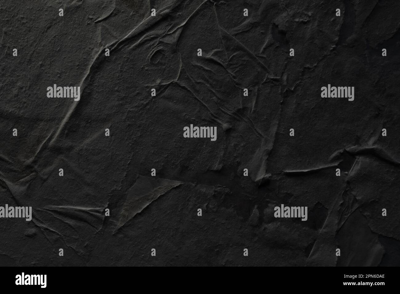Black crumpled poster paper texture background Stock Photo - Alamy
