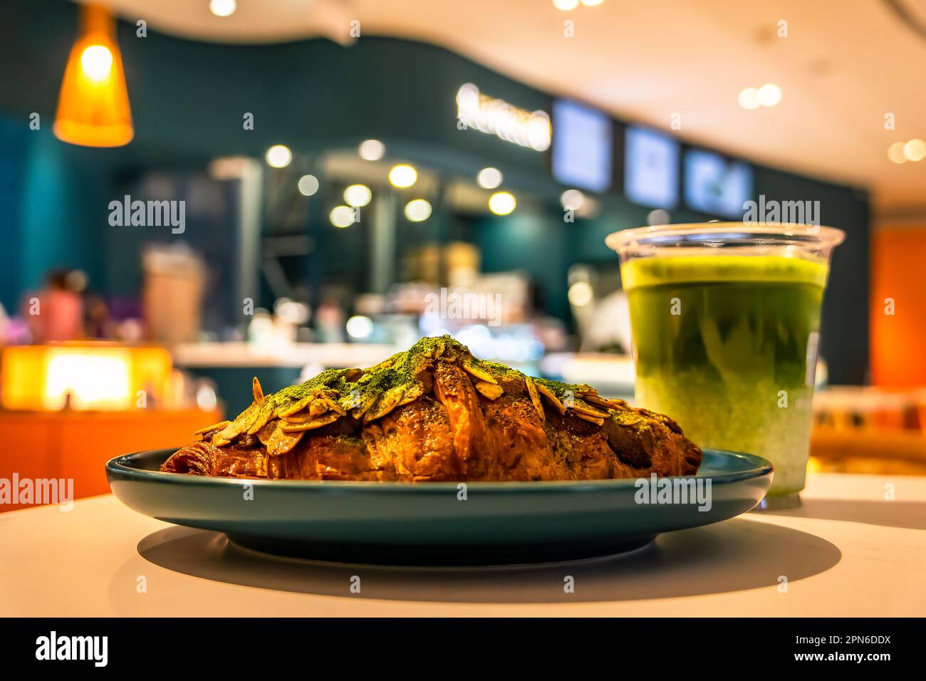 Flaky croissant filled with green tea and almond paste. Topped with ...