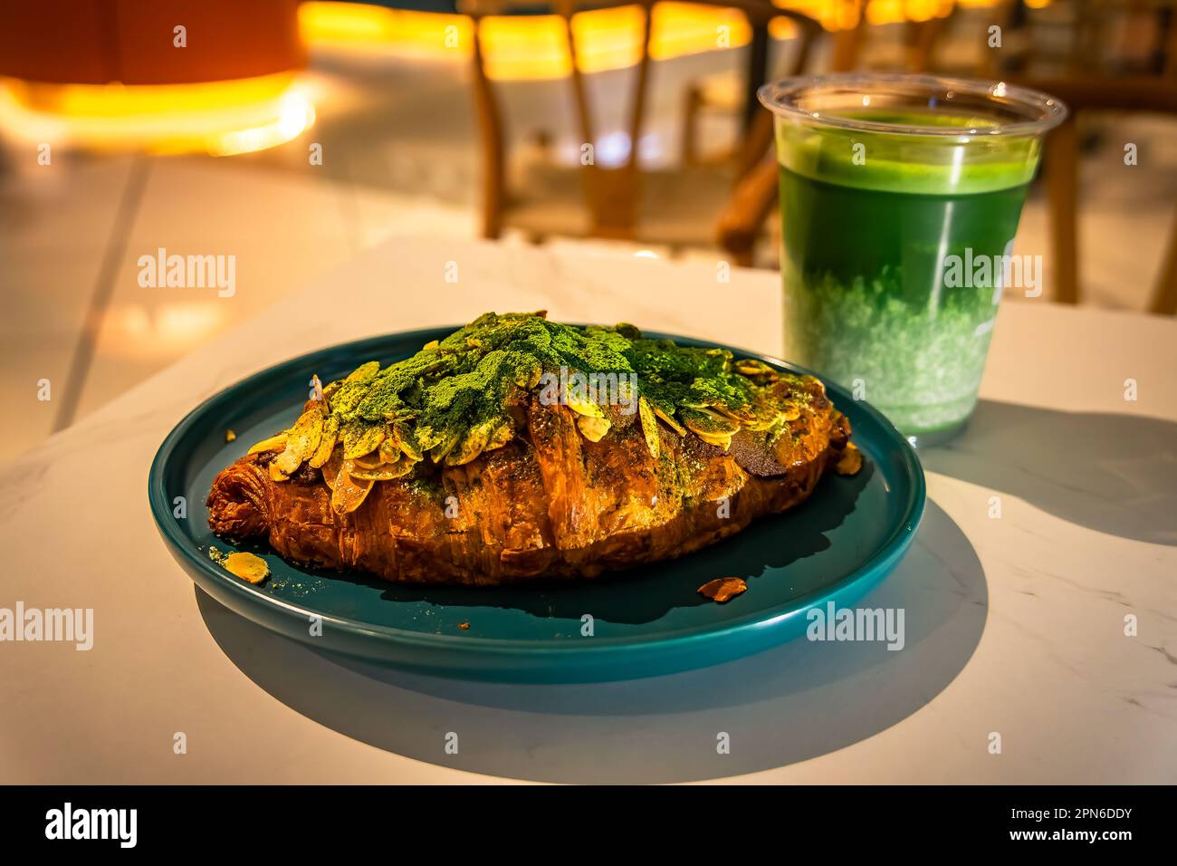 Flaky croissant filled with green tea and almond paste. Topped with ...