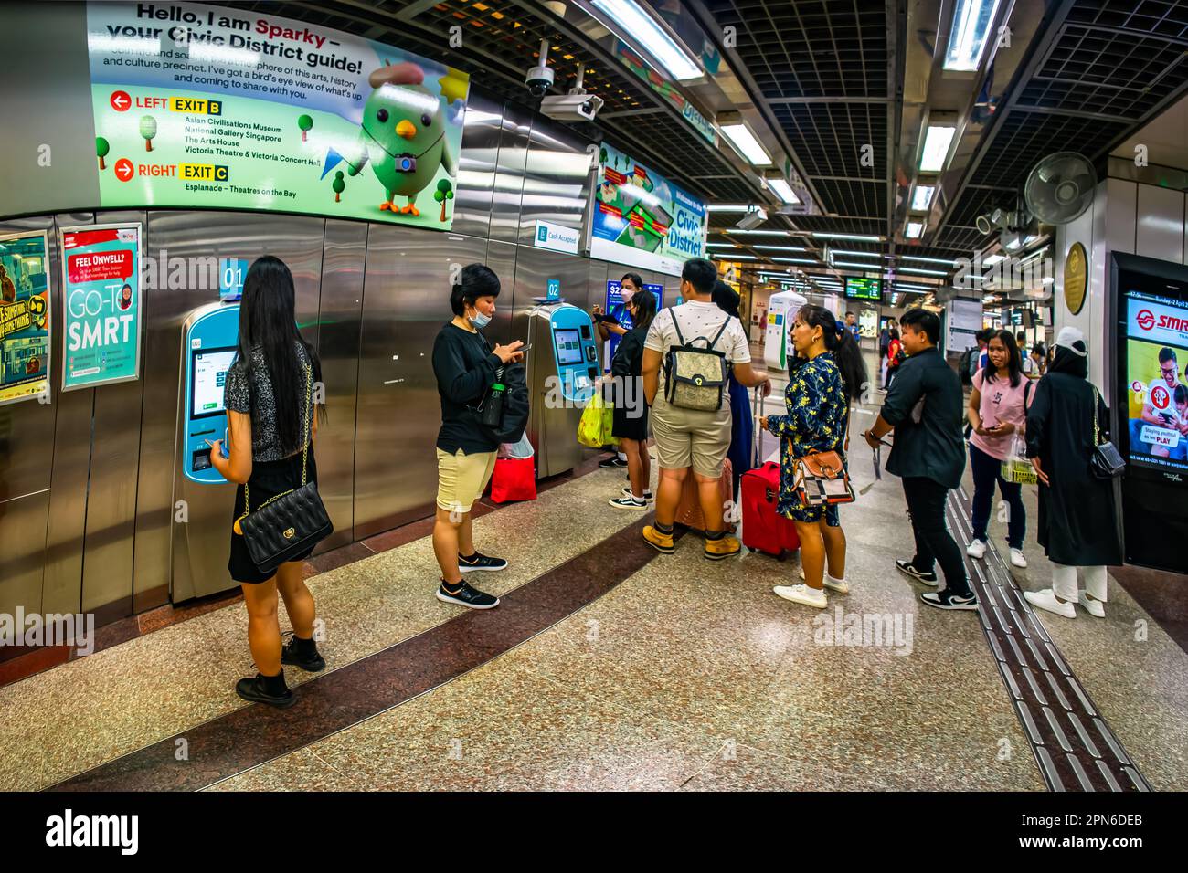 Passengers buying ticket at City Hall MRT station in Singapore Stock ...