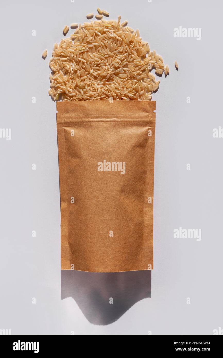 Kraft paper pouch bag with whole grain brown rice top view with harsh ...