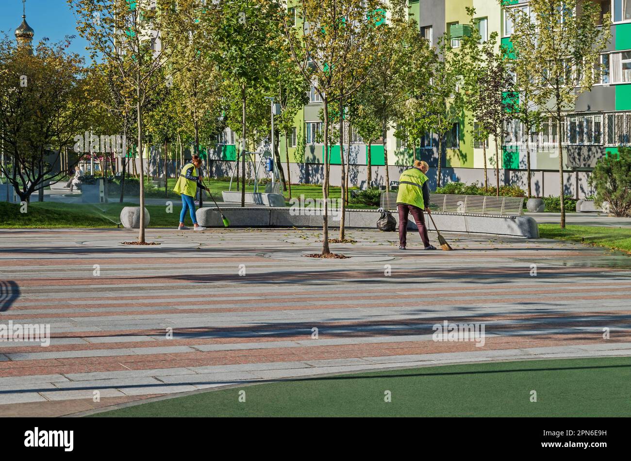 Janitor sweeping footpath on street hi-res stock photography and images ...