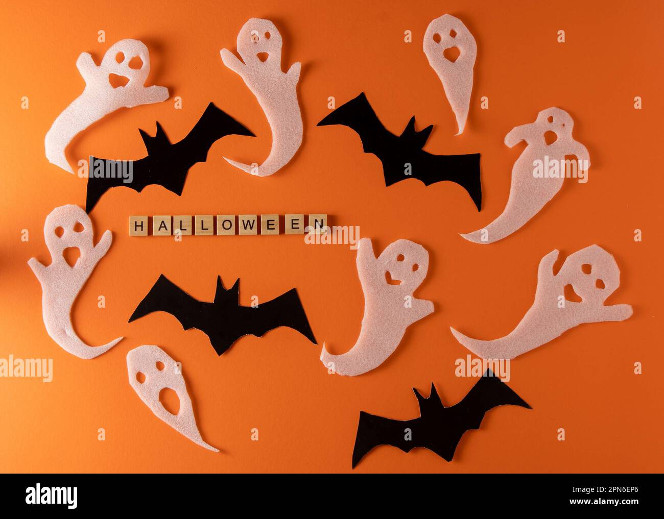 White ghosts and bat craft for Halloween party. Wrapping paper ghost on ...