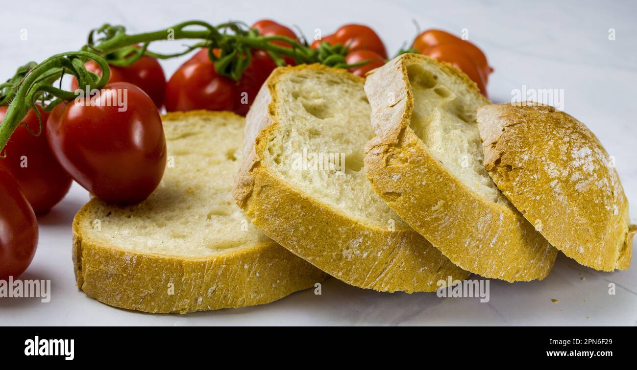 Homemade fresh crusty bread with tomatoes Stock Photo - Alamy