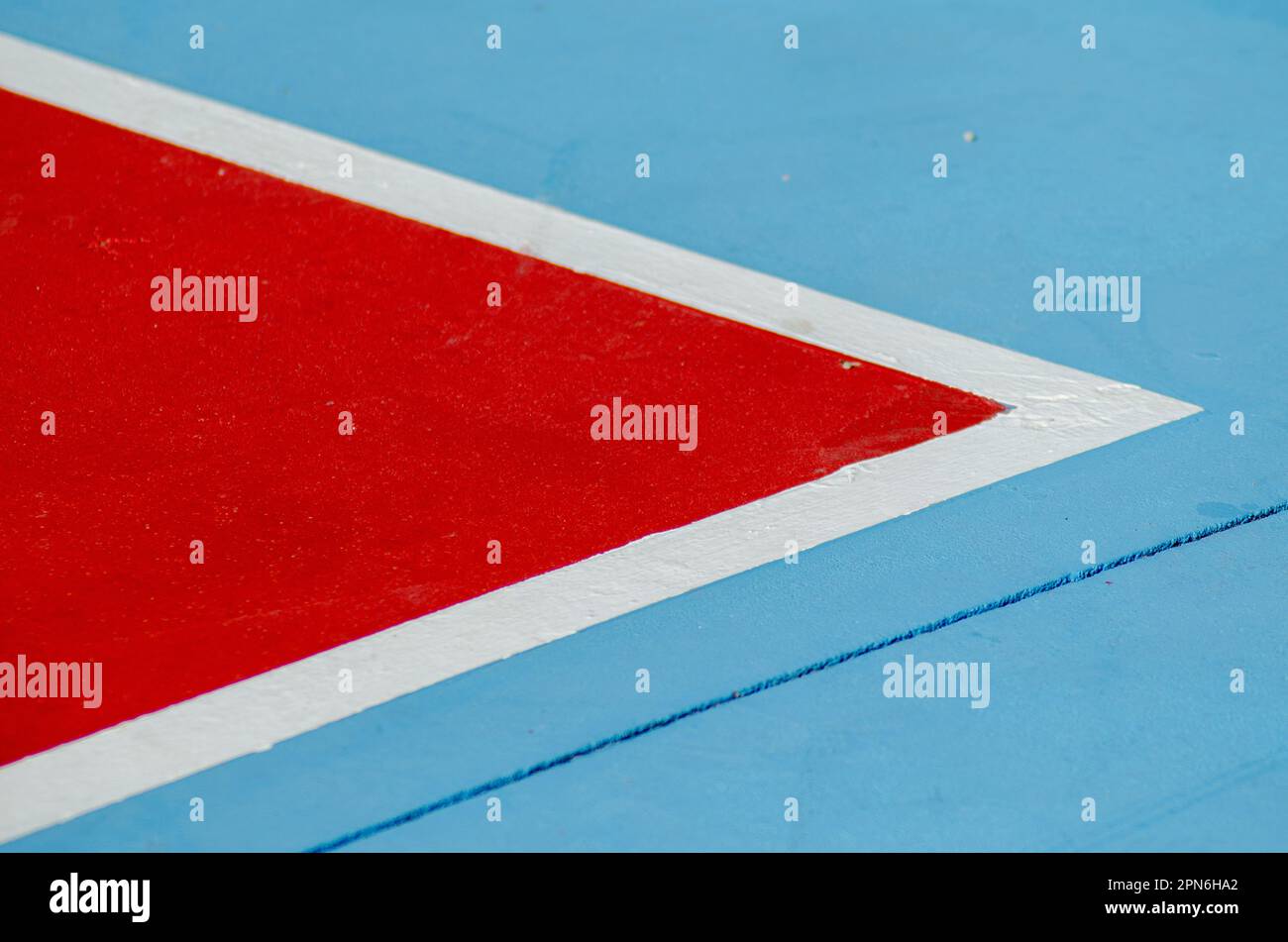detail of a corner of a red and blue tennis court Stock Photo - Alamy