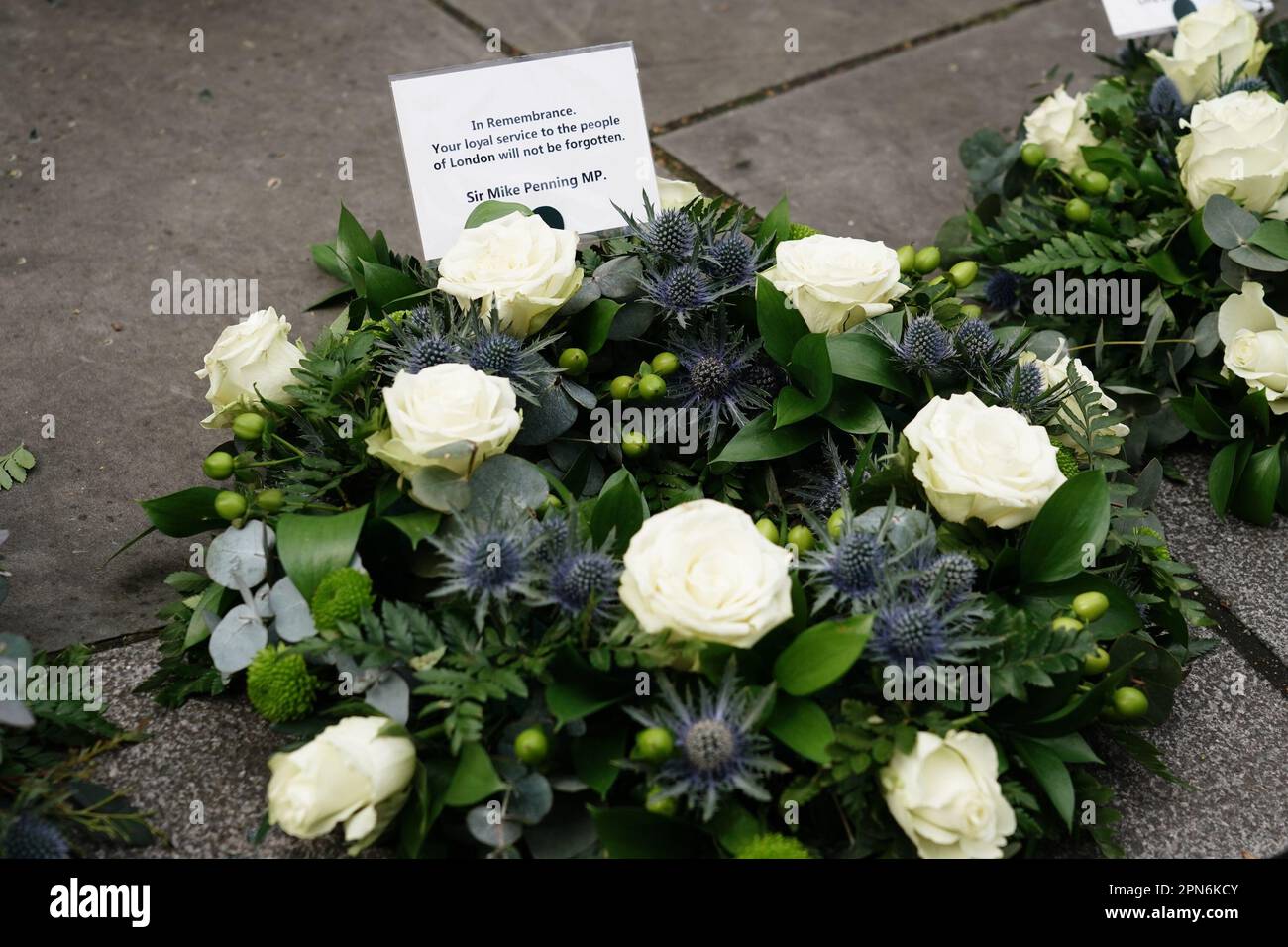 A wreath and message prior to being placed at a memorial service for ...
