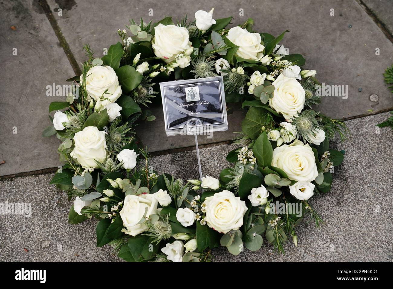 A wreath and message prior to being placed at a memorial service for ...
