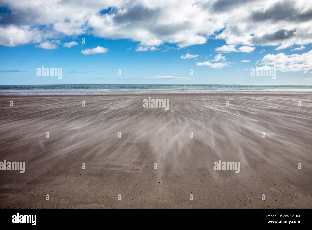 Strong winds blowing sand around on the Beach Stock Photo - Alamy