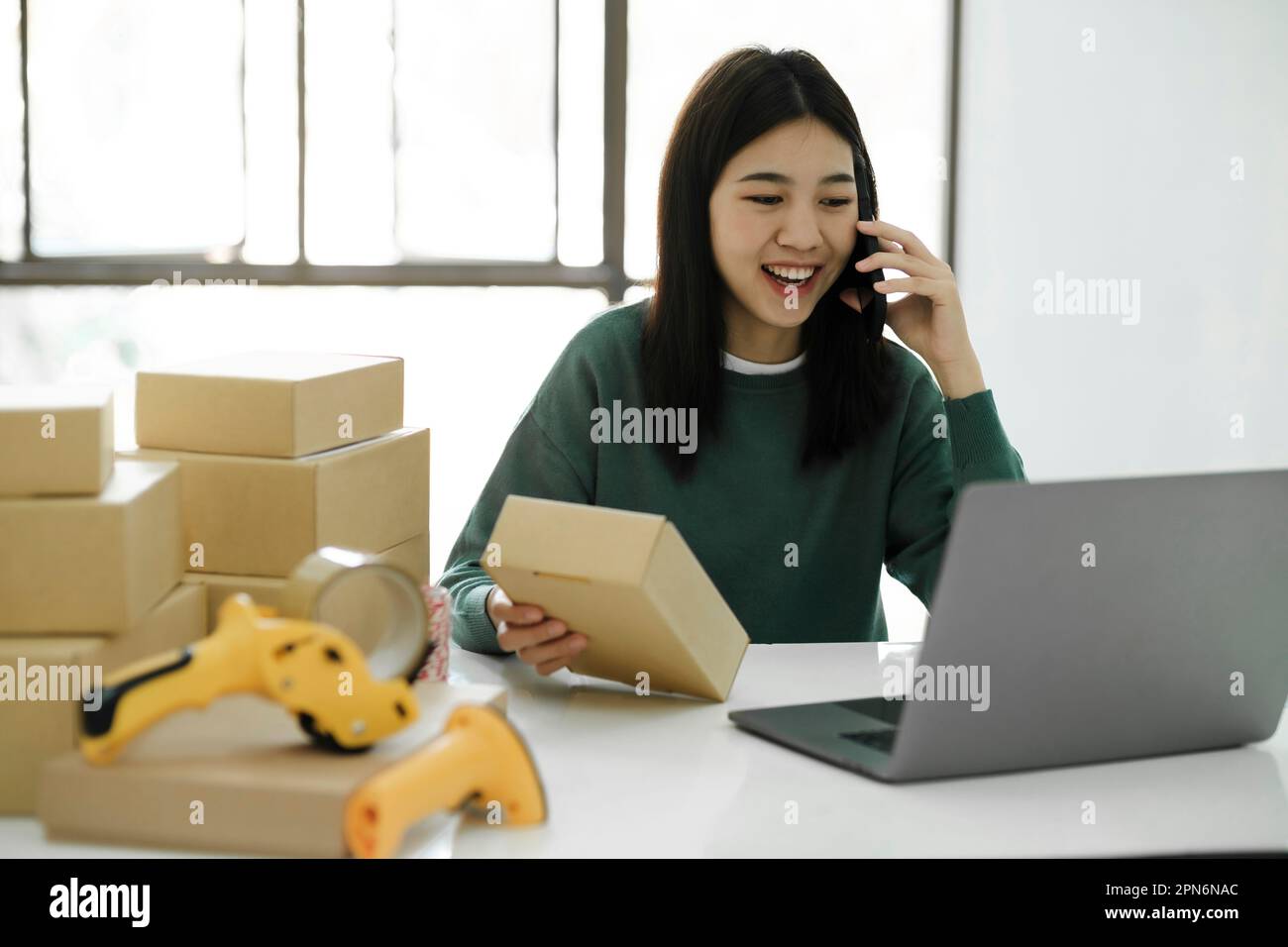 Female online business, store owner talking to customer using sm Stock ...