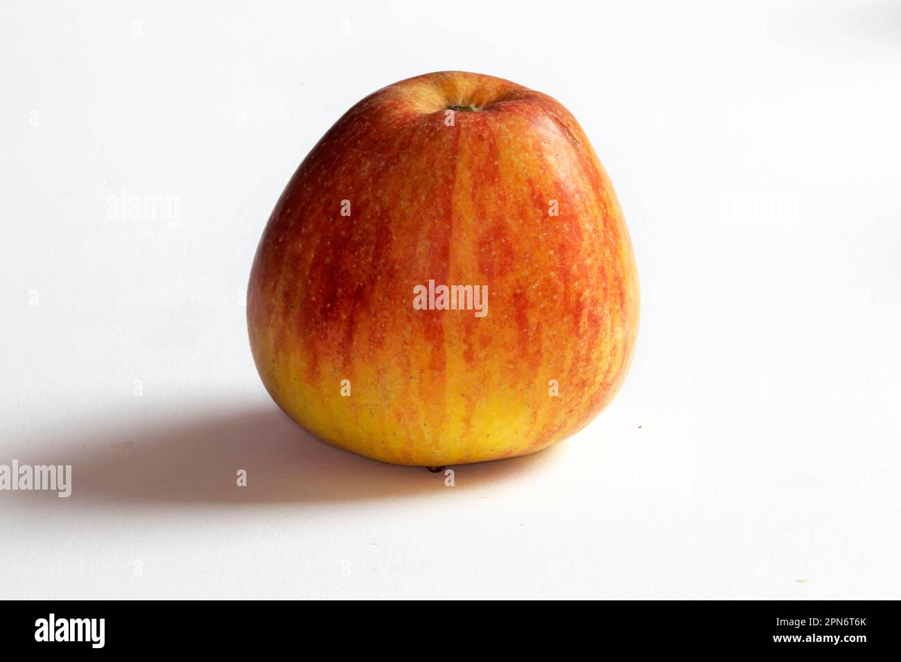 Two-tone apple on white background Stock Photo - Alamy