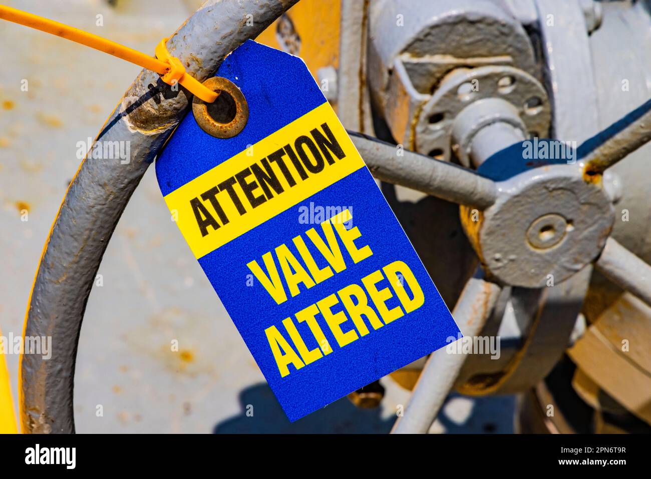Valve tag on an offshore oil platform Stock Photo - Alamy