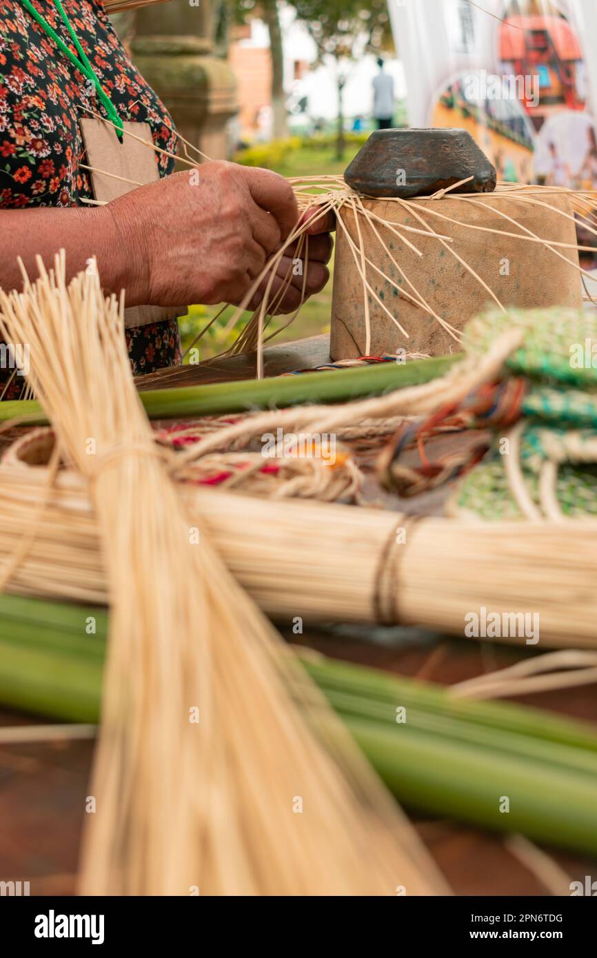 artisan hands weaving a straw hat Stock Photo - Alamy