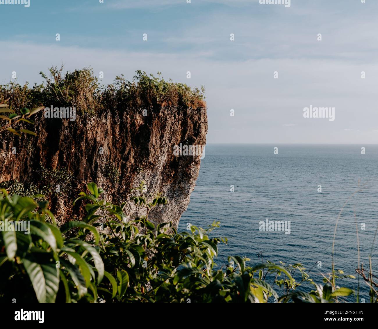 Exploring ocean and cliff views in Bali Stock Photo - Alamy