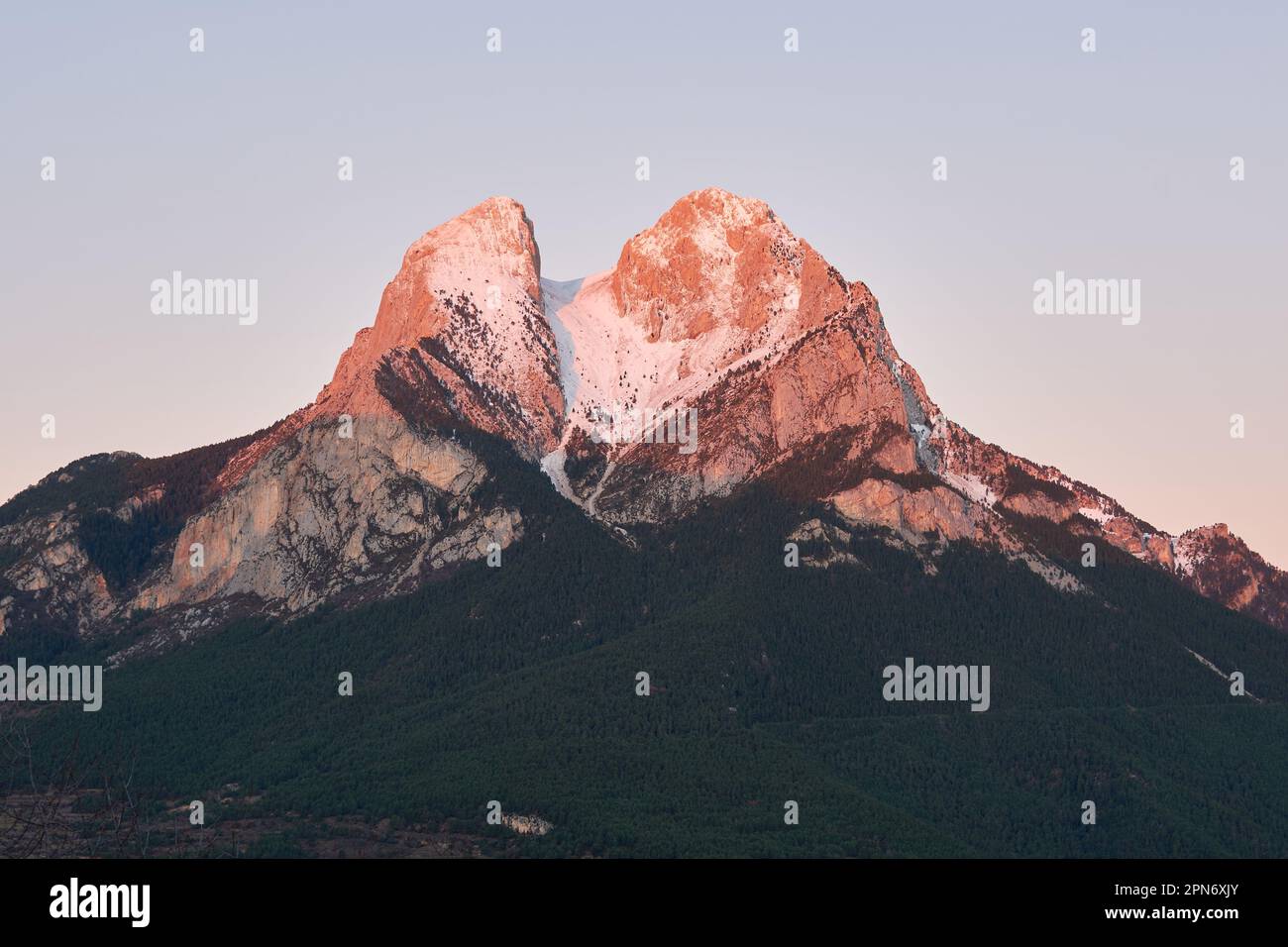 The summit of Pedraforca mountain with snow, one of the most legendary ...