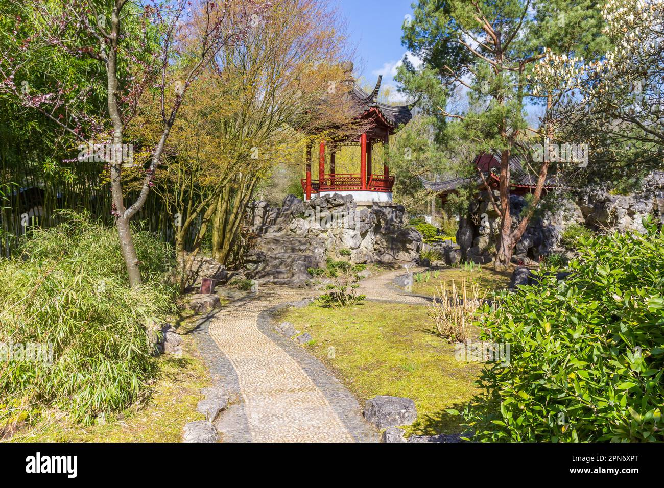 Path leading to a small chinese temple in the botanical garden of Haren ...