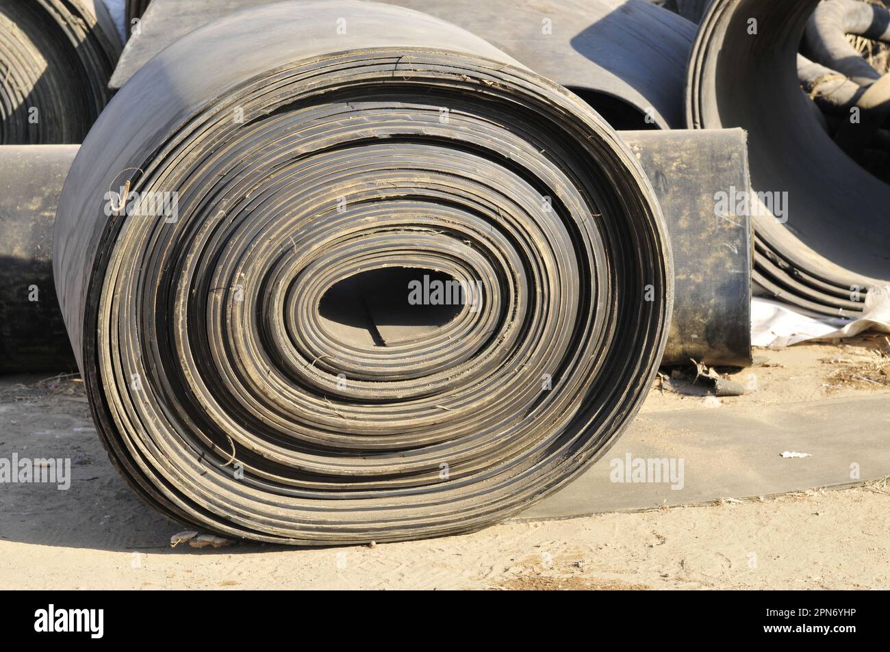 Take line black insulating rubber roller Stock Photo - Alamy
