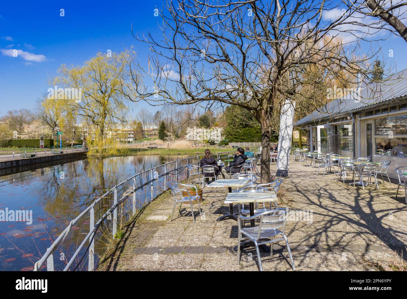 People enjoying the spring sun at a cafe in the botanical gardens of ...