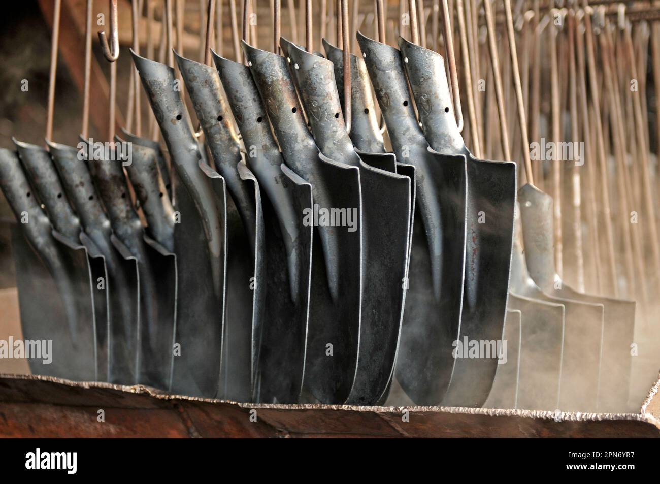 Mechanism steel shovel production line Stock Photo - Alamy