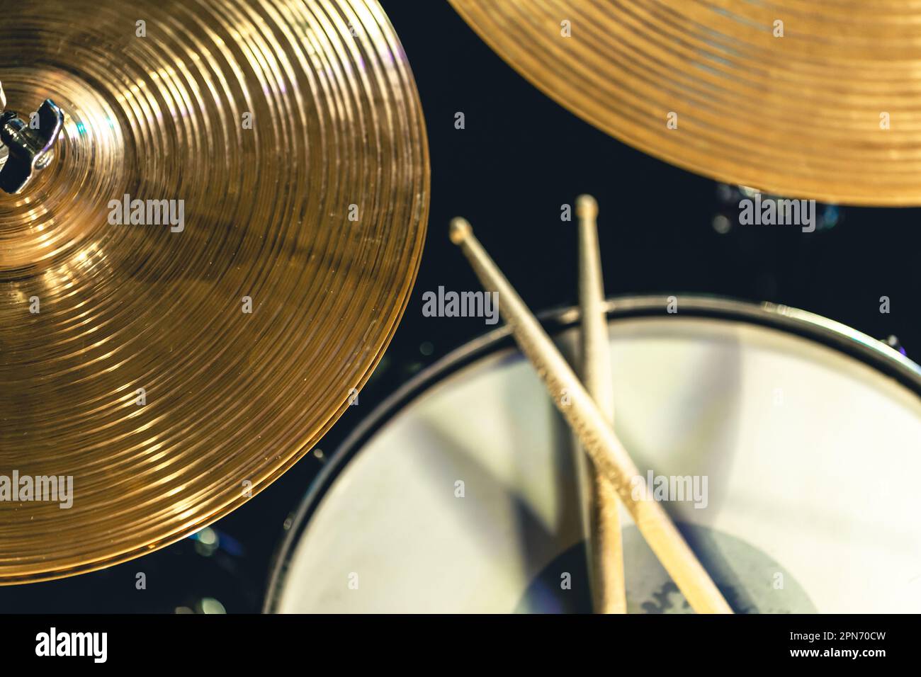 Drum cymbal close-up on a dark background Stock Photo - Alamy