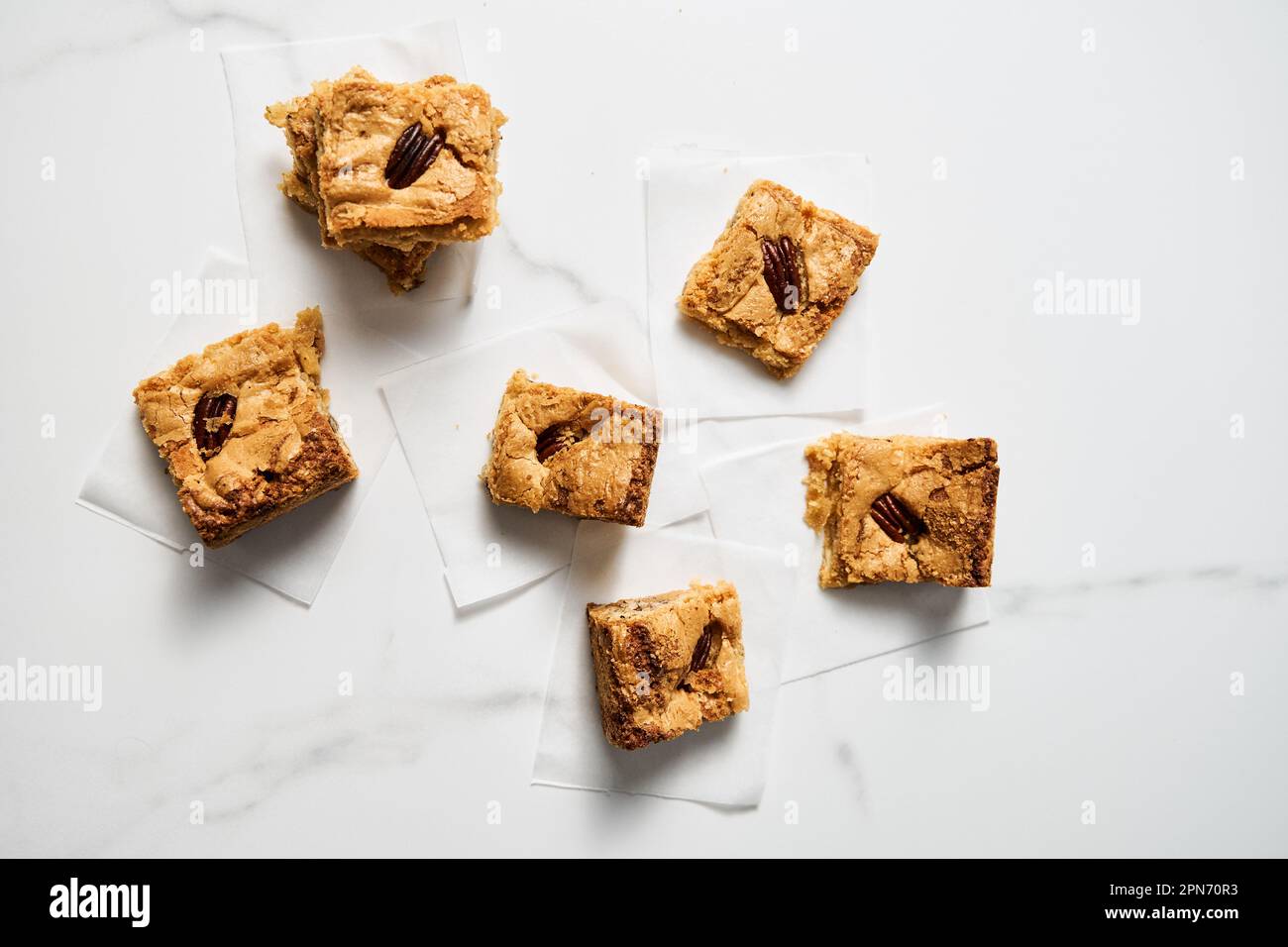 blondie cookies squares on white marble countertop background. White ...