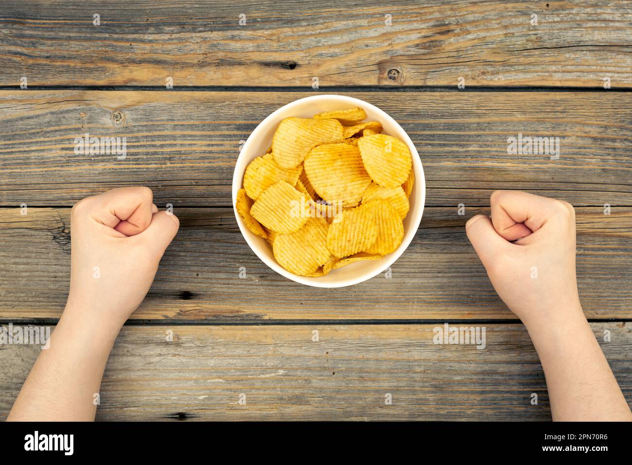 Close-up, a plate of potato chips in female hands, top view Stock Photo ...