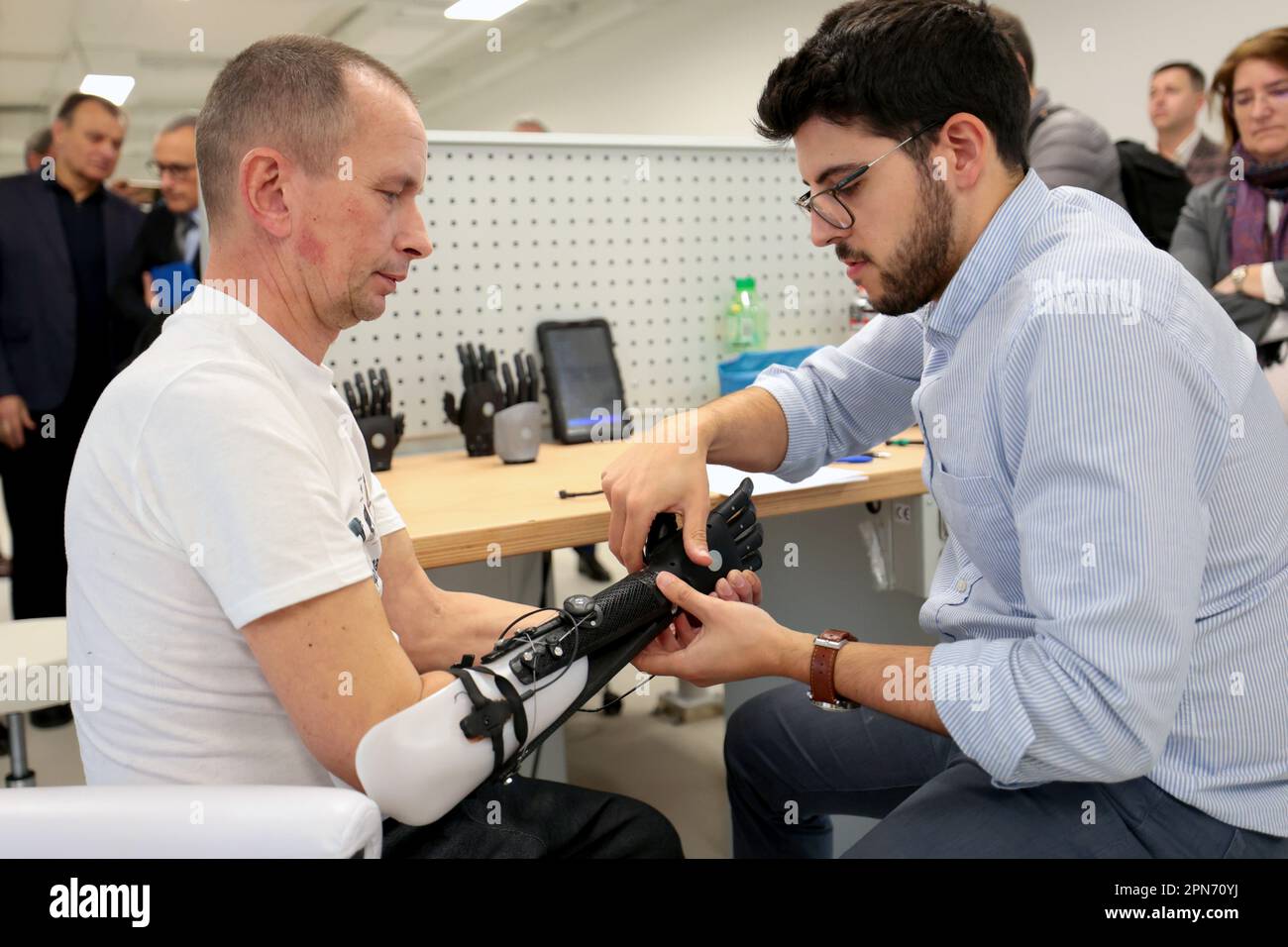 LVIV, UKRAINE - APRIL 14, 2023 - A doctor fits a prosthetic arm on one ...