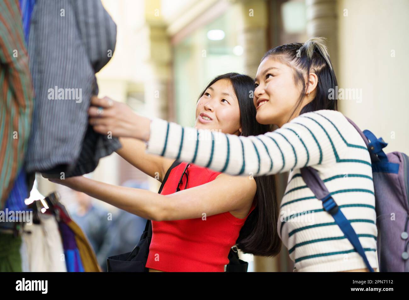 Female customer looking clothes in hi-res stock photography and images ...