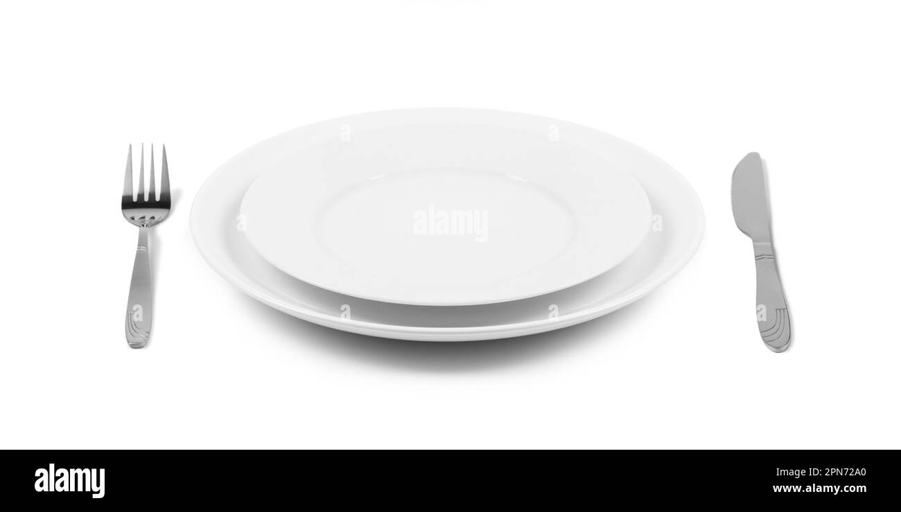 Empty plates on table Black and White Stock Photos & Images - Alamy