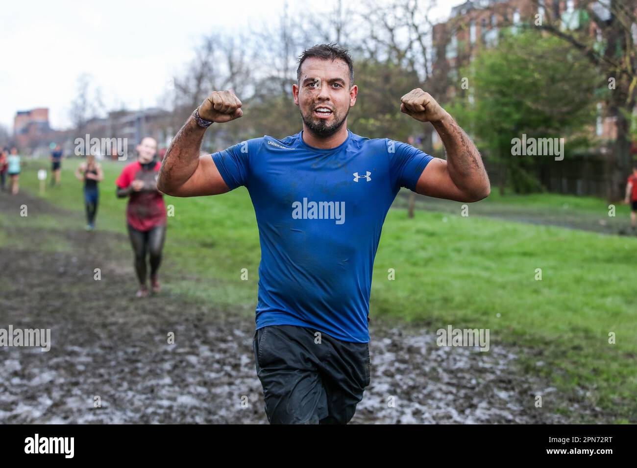 A participant takes part in the Tough Mudder race in Finsbury Park ...