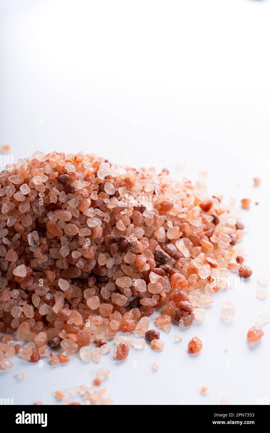 Himalayan pink salt is herb seasoning isolated on white background with ...