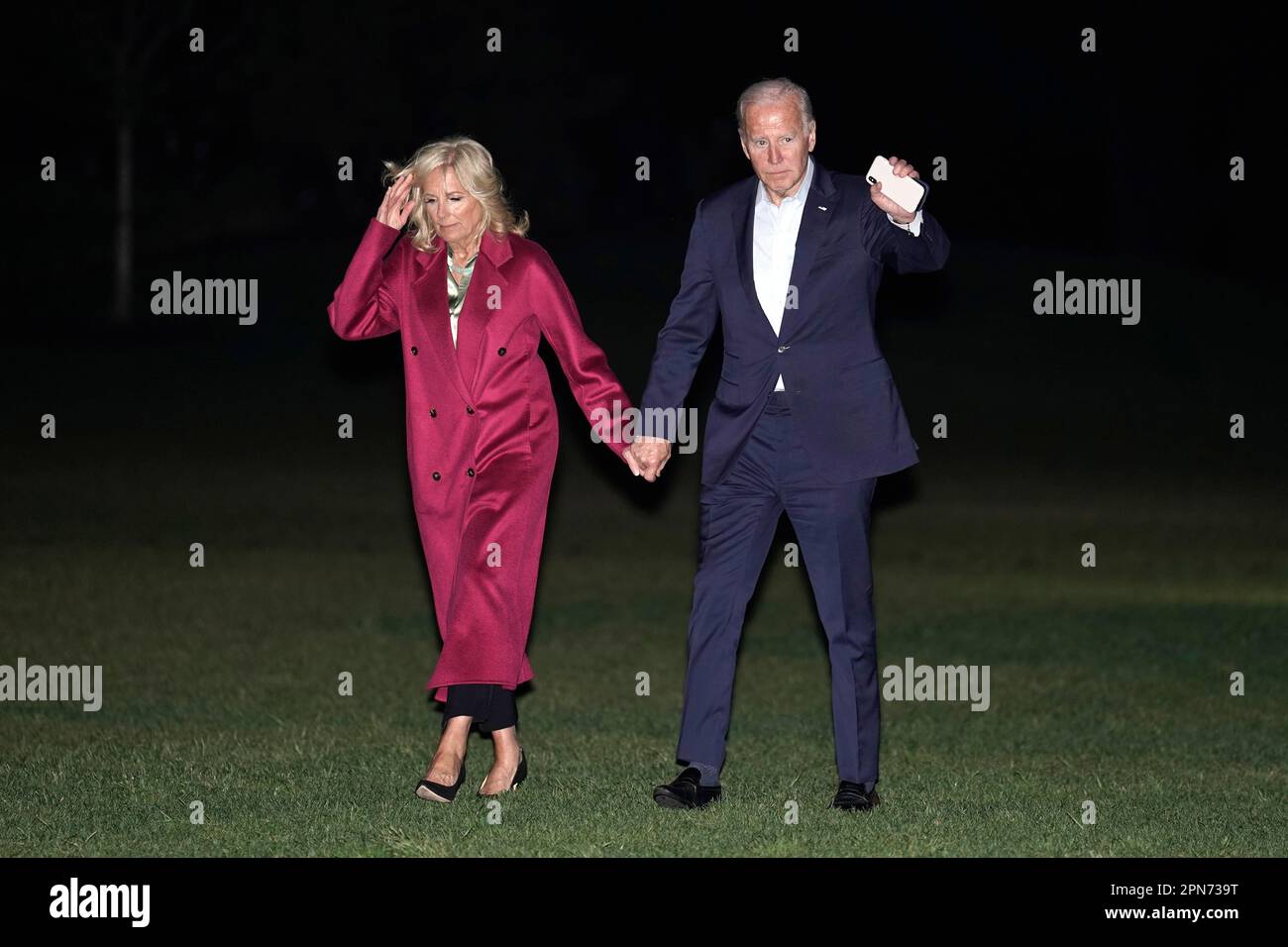 United States President Joe Biden and first lady Dr. Jill Biden walk on ...