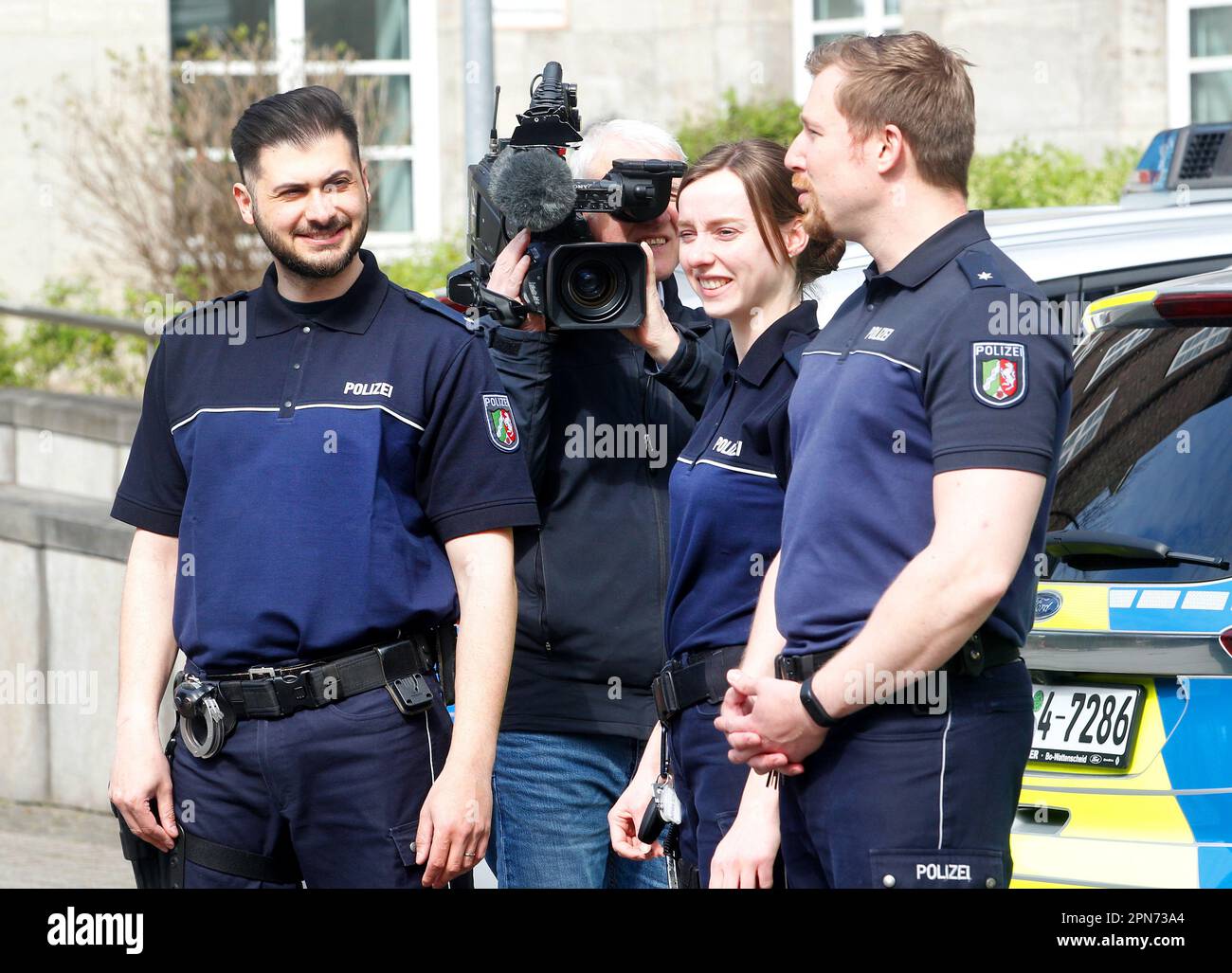 Bochum, Germany. 17th Apr, 2023. A policewoman and two of her ...