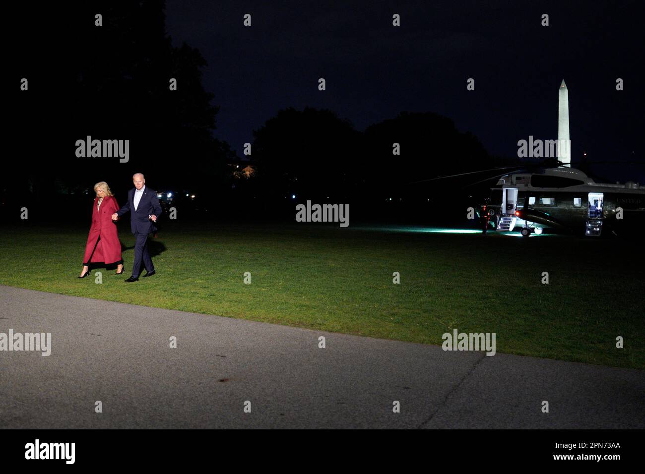 United States President Joe Biden and first lady Dr. Jill Biden walk on ...