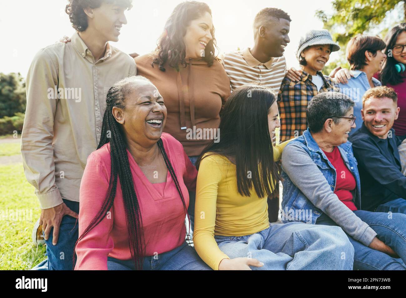 Group of multigenerational people smiling in front of camera - Multiracial friends with ...
