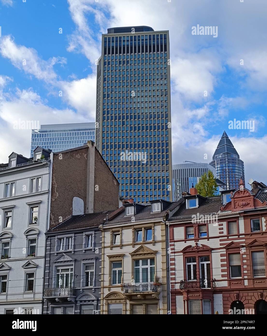 Old monuments and buildings with tall skyscrapers in the background ...