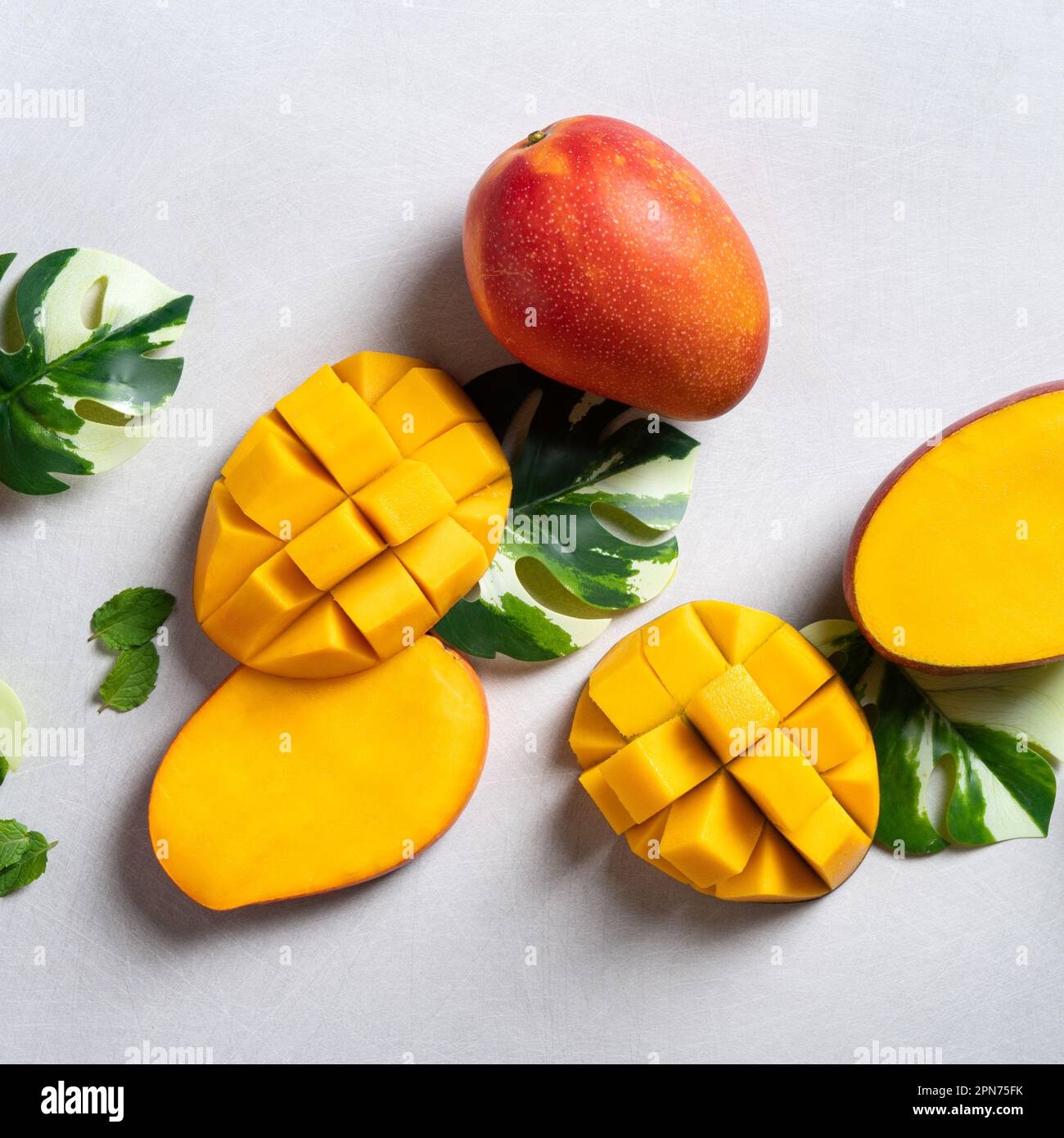 Mango background design concept. Top view of diced fresh mango fruit ...