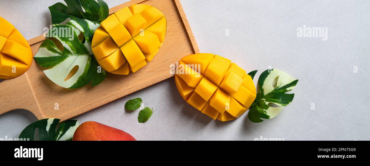 Mango background design concept. Top view of diced fresh mango fruit ...